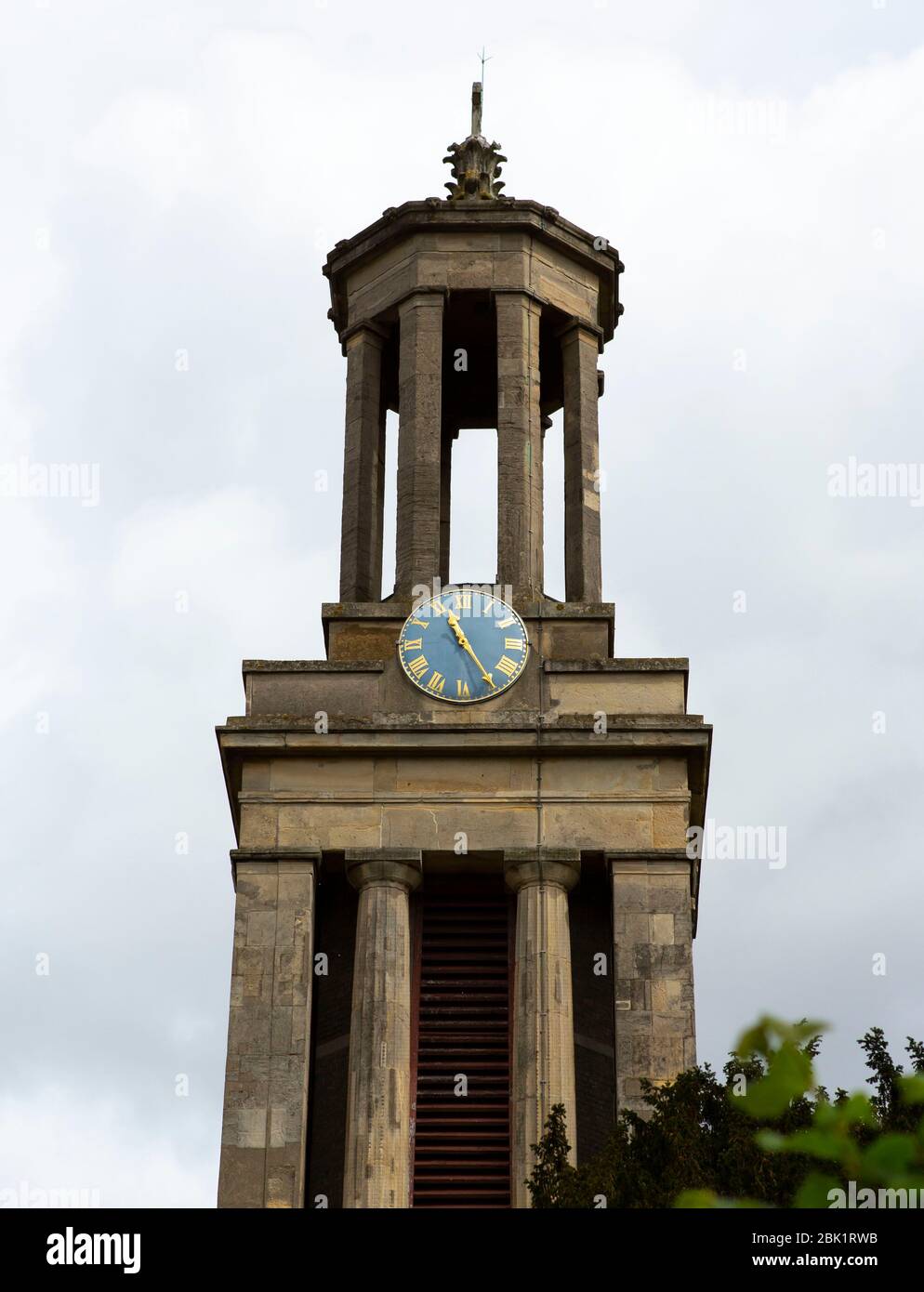 Church clock tower with blue and gold clock face Stock Photo - Alamy