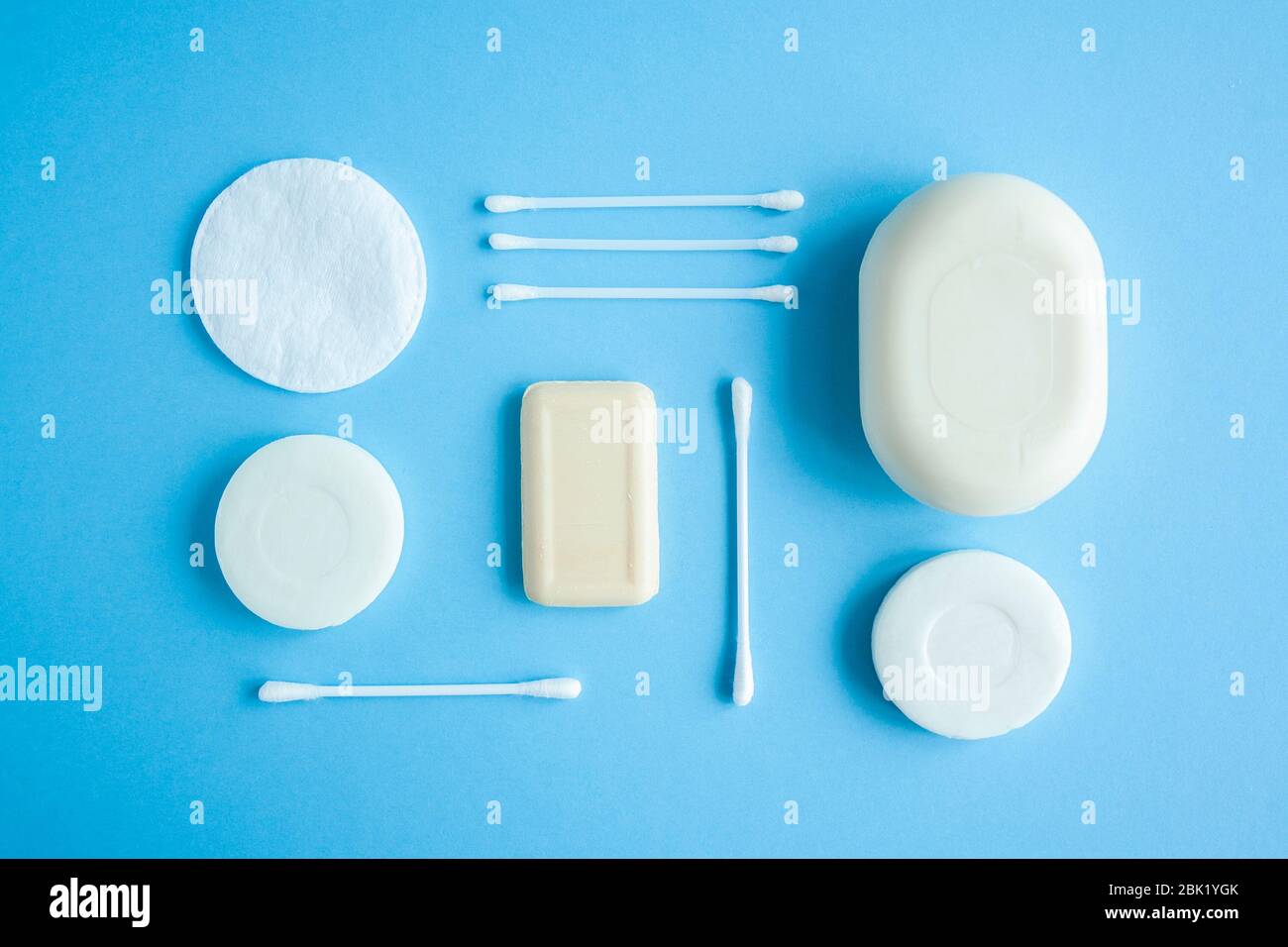 Composition of soap, cotton swabs and cotton pads top view. Self ...