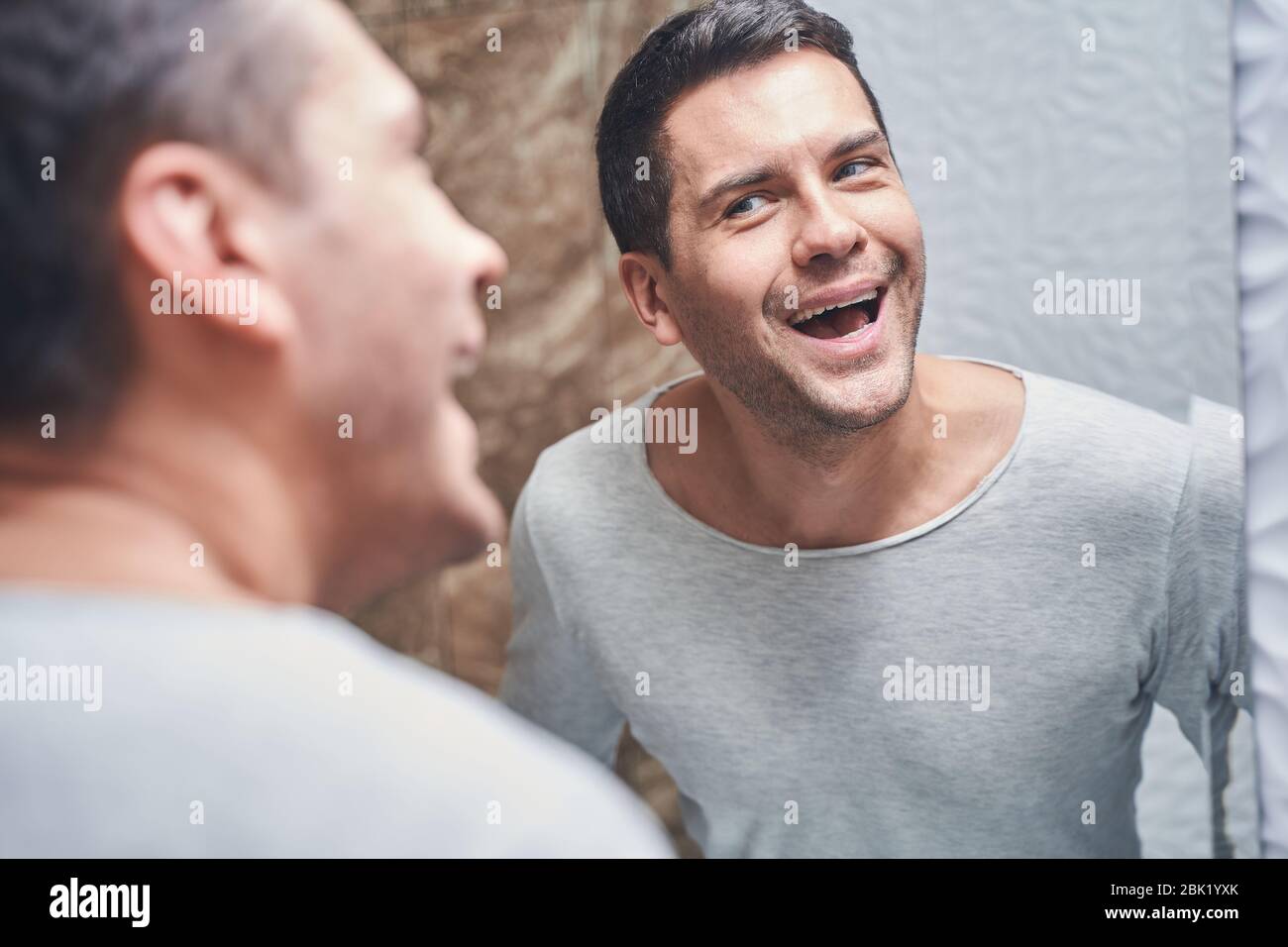Person staring in mirror hi-res stock photography and images - Alamy