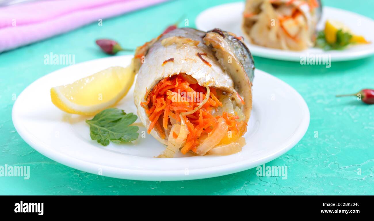 Baked herring stuffed with vegetables. Tasty fish rolls Stock Photo - Alamy