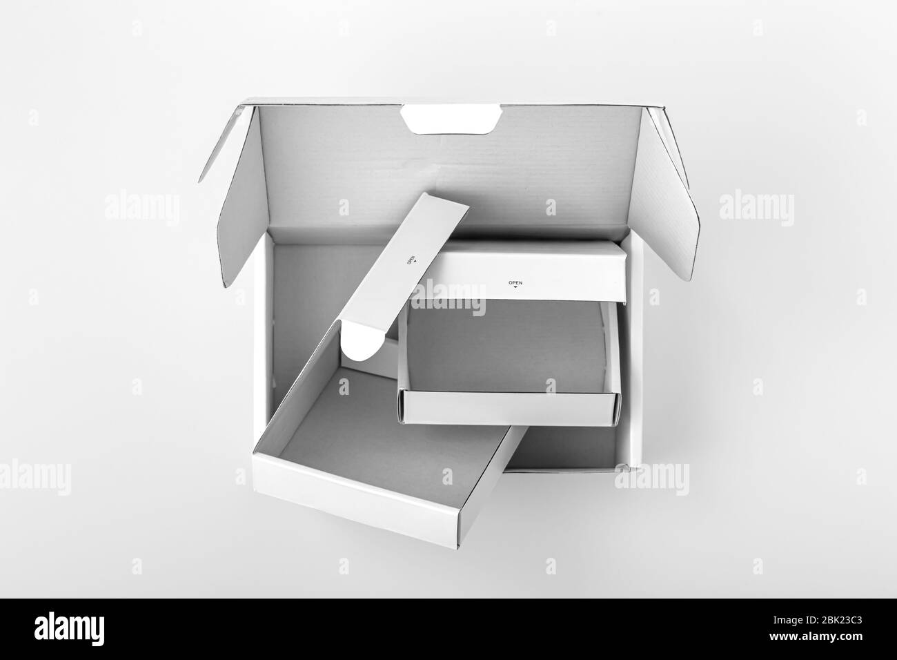 Opened empty white packaging boxes with different size, top view Stock ...