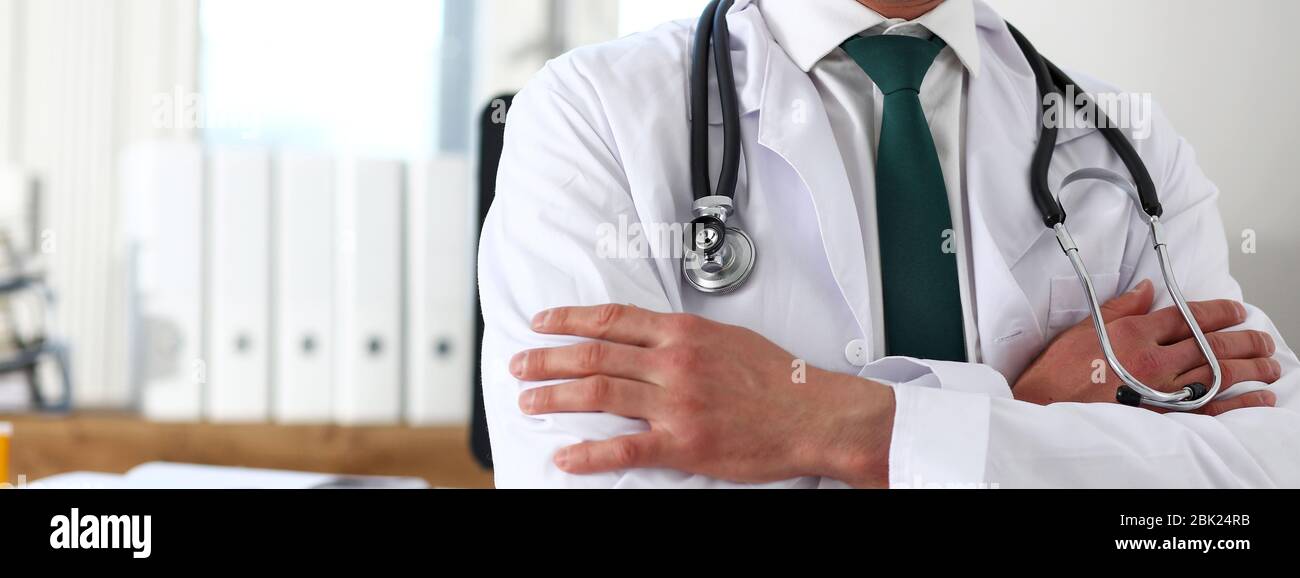 Male medicine doctor hands crossed on his chest in office Stock Photo ...