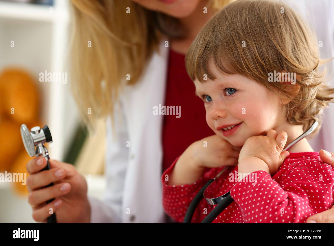 Little child with stethoscope at doctor reception Stock Photo - Alamy