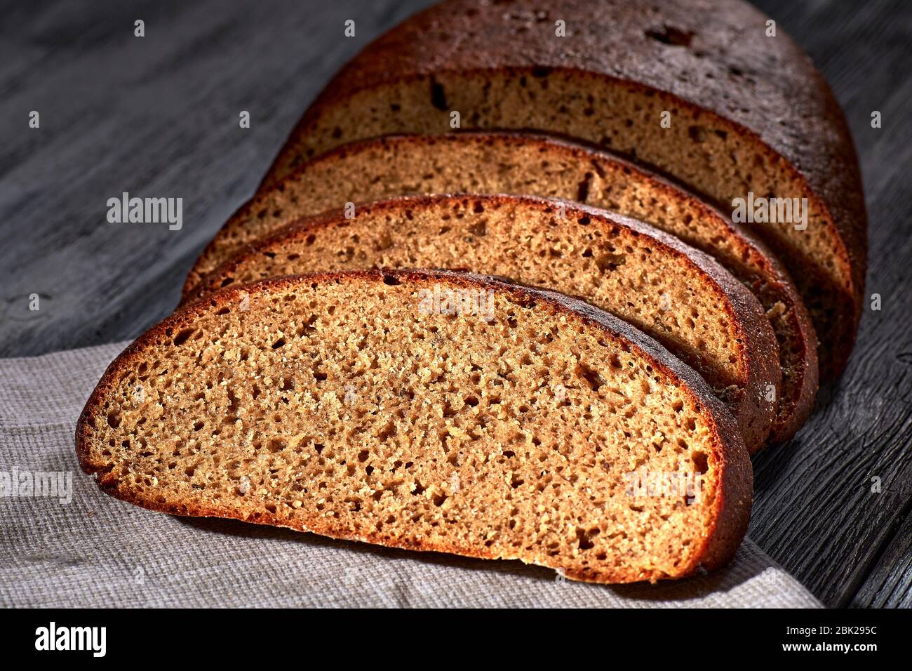 Homemade rye European bread on a dark background Stock Photo - Alamy