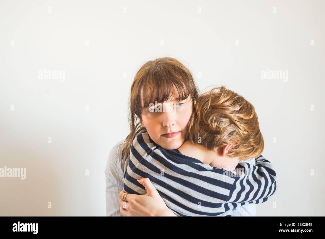 Young mother and child hugging. Mothers day Stock Photo - Alamy