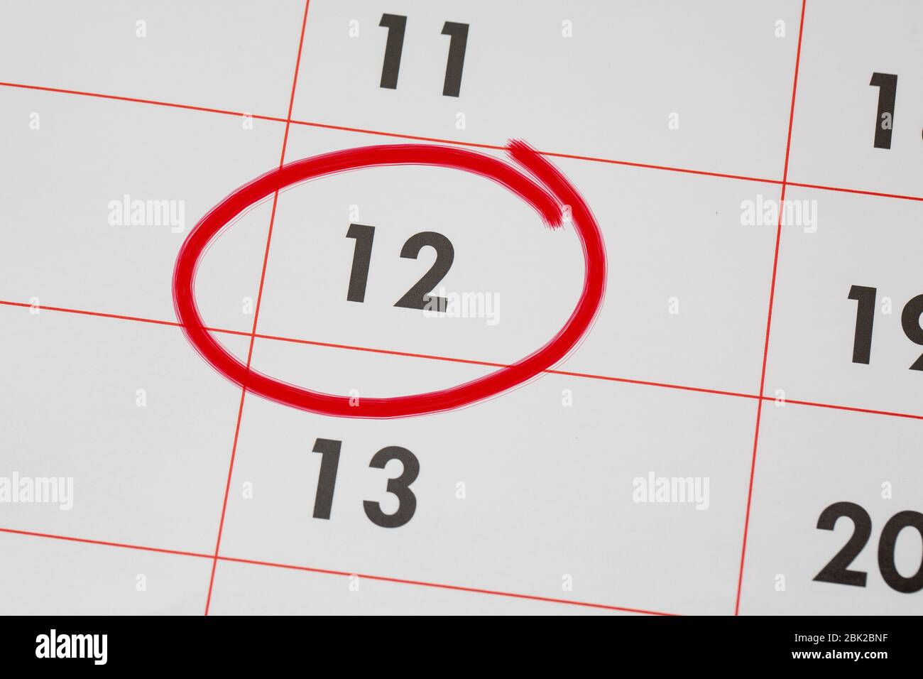 12th Date of the Month marked in red marker pen on a simple planner ...