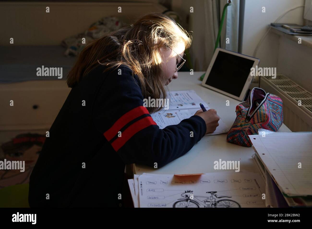 Real 10 year old girl is doing homeschooling, learning at home, doing ...