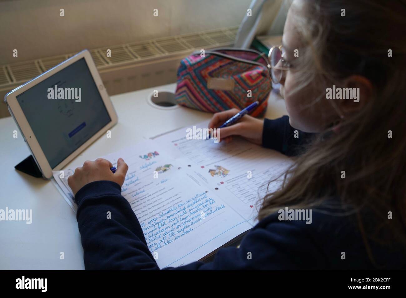 Real 10 year old girl is doing homeschooling, learning at home, doing ...