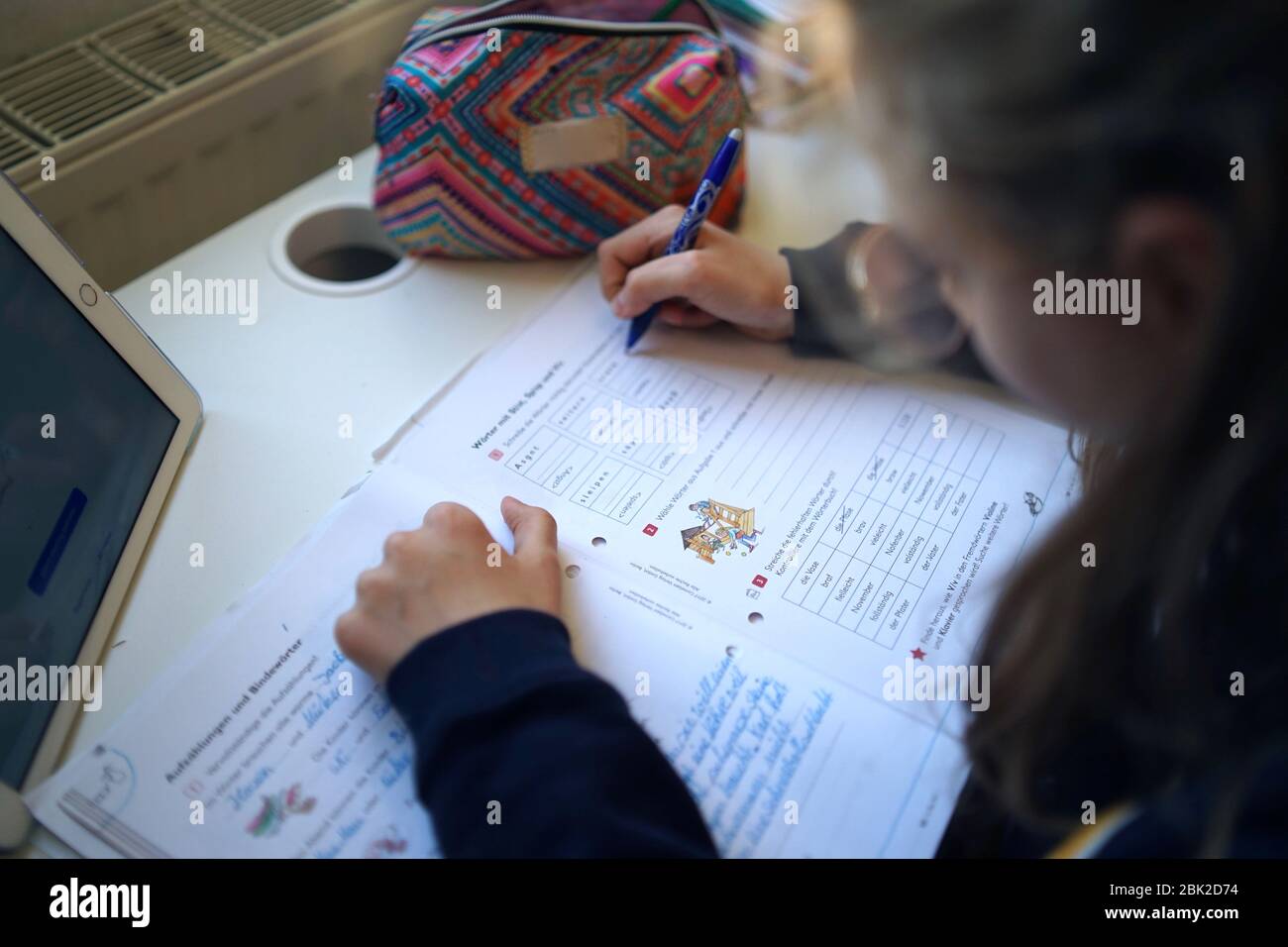 Real 10 year old girl is doing homeschooling, learning at home, doing ...