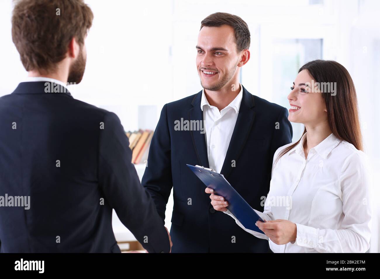 Arab businessman and his translator welcome business partner and says ...