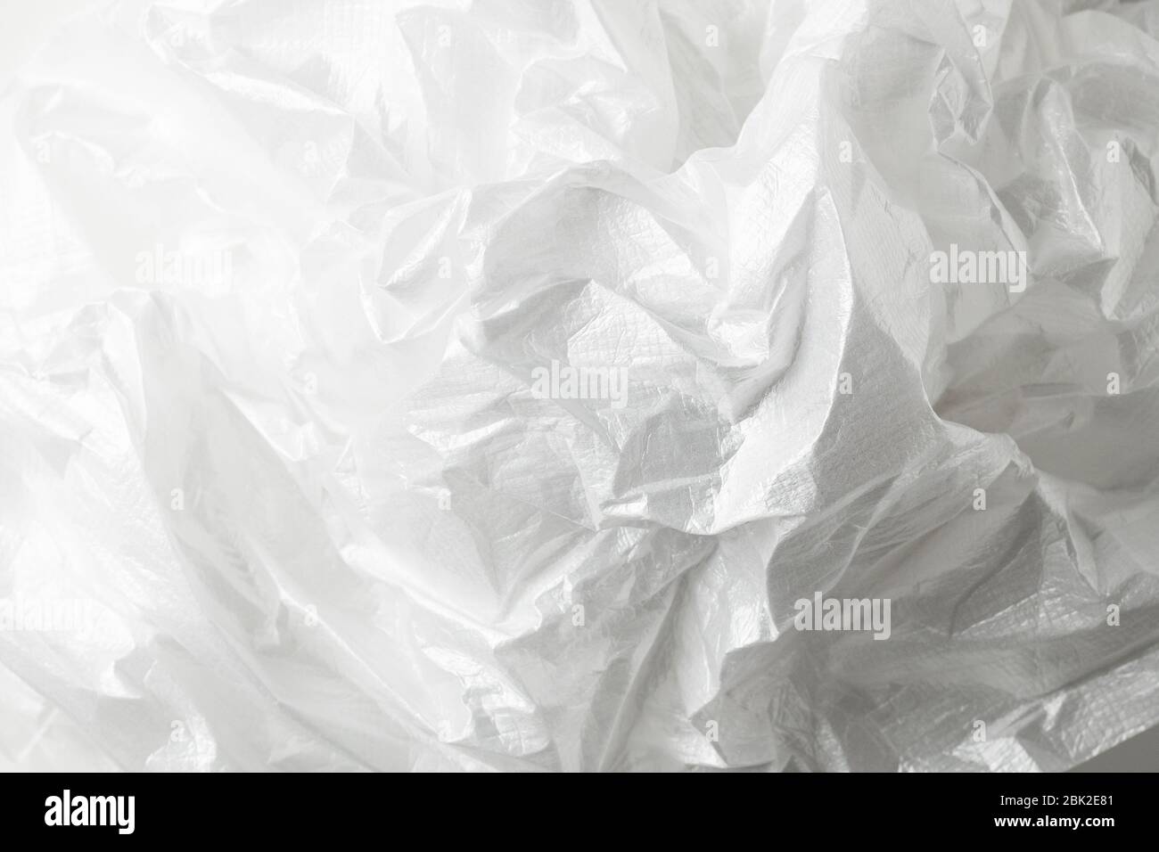 Squeeze a crumpled foam sheet isolated on white background with copy ...
