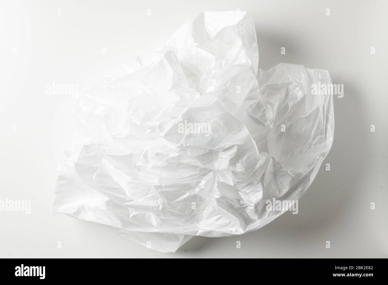 Squeeze a crumpled foam sheet isolated on white background with copy ...