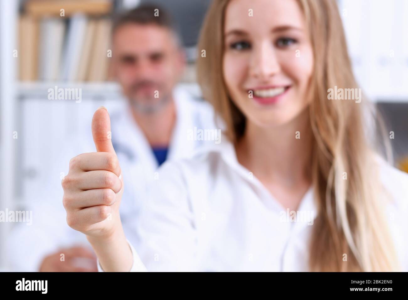 Arm show OK or confirm with thumb up Stock Photo - Alamy
