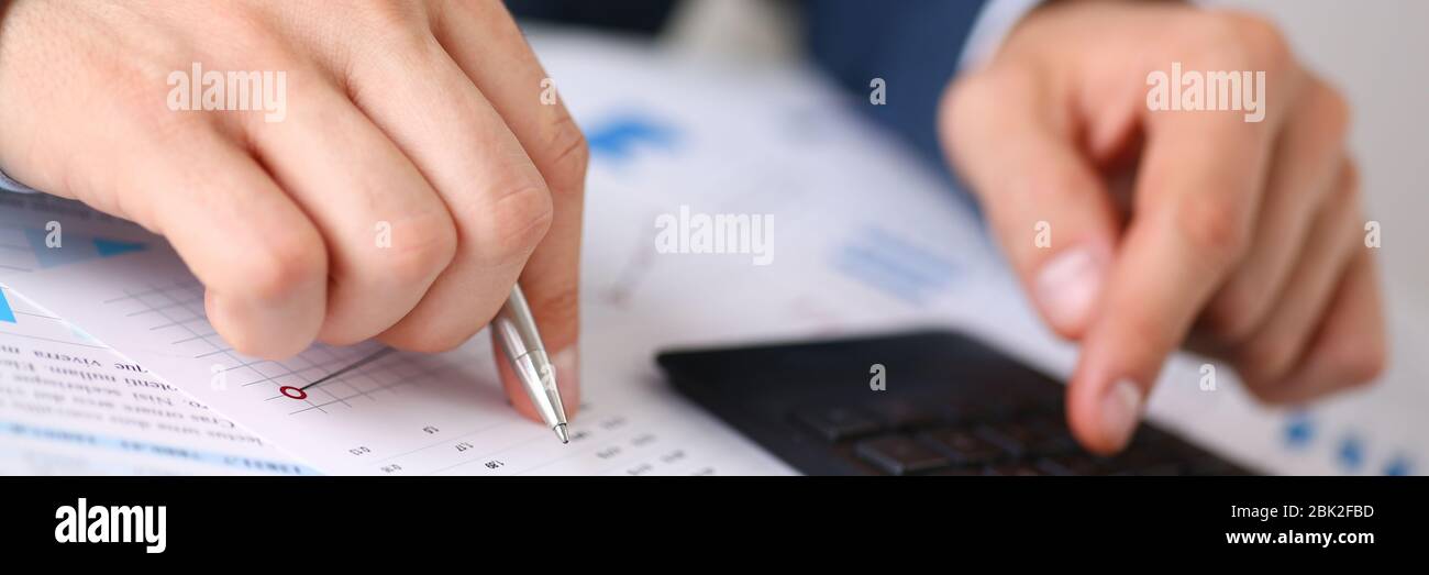 Black calculator and financial statistics on infographics Stock Photo ...