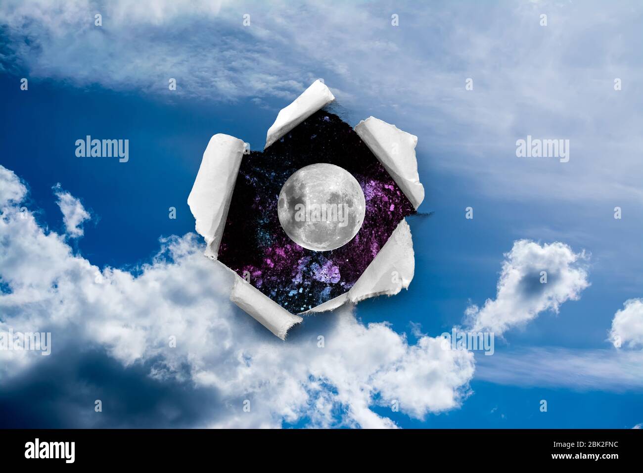 A hole in the day sky with torn edges, as if on paper, overlooking the ...