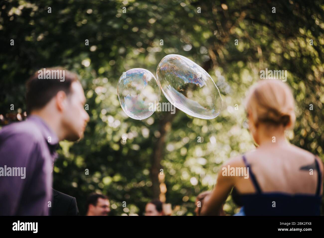 soap bubbles in summer fun family times Stock Photo - Alamy