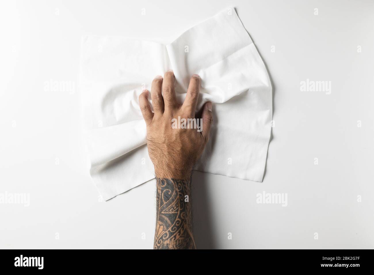 top view of hand with white cleaning rag isolated on white background ...