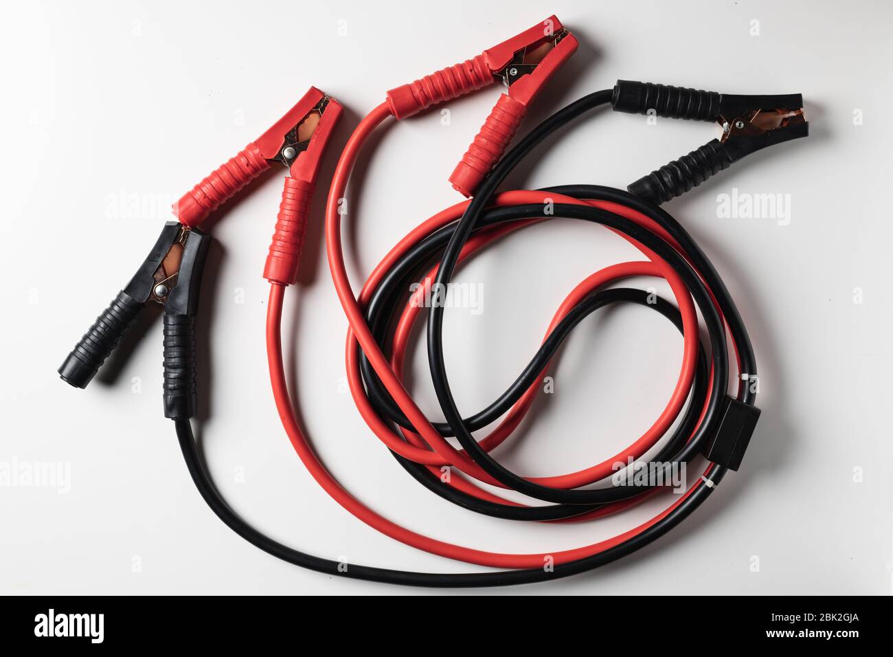 Black and red jumper cable isolated on white background Stock Photo - Alamy