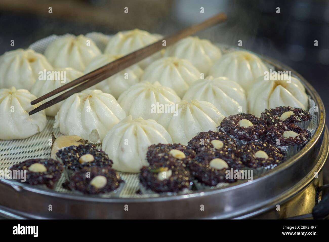 "Baozi", a traditional Chinese dumplings. At the street food stand in ...