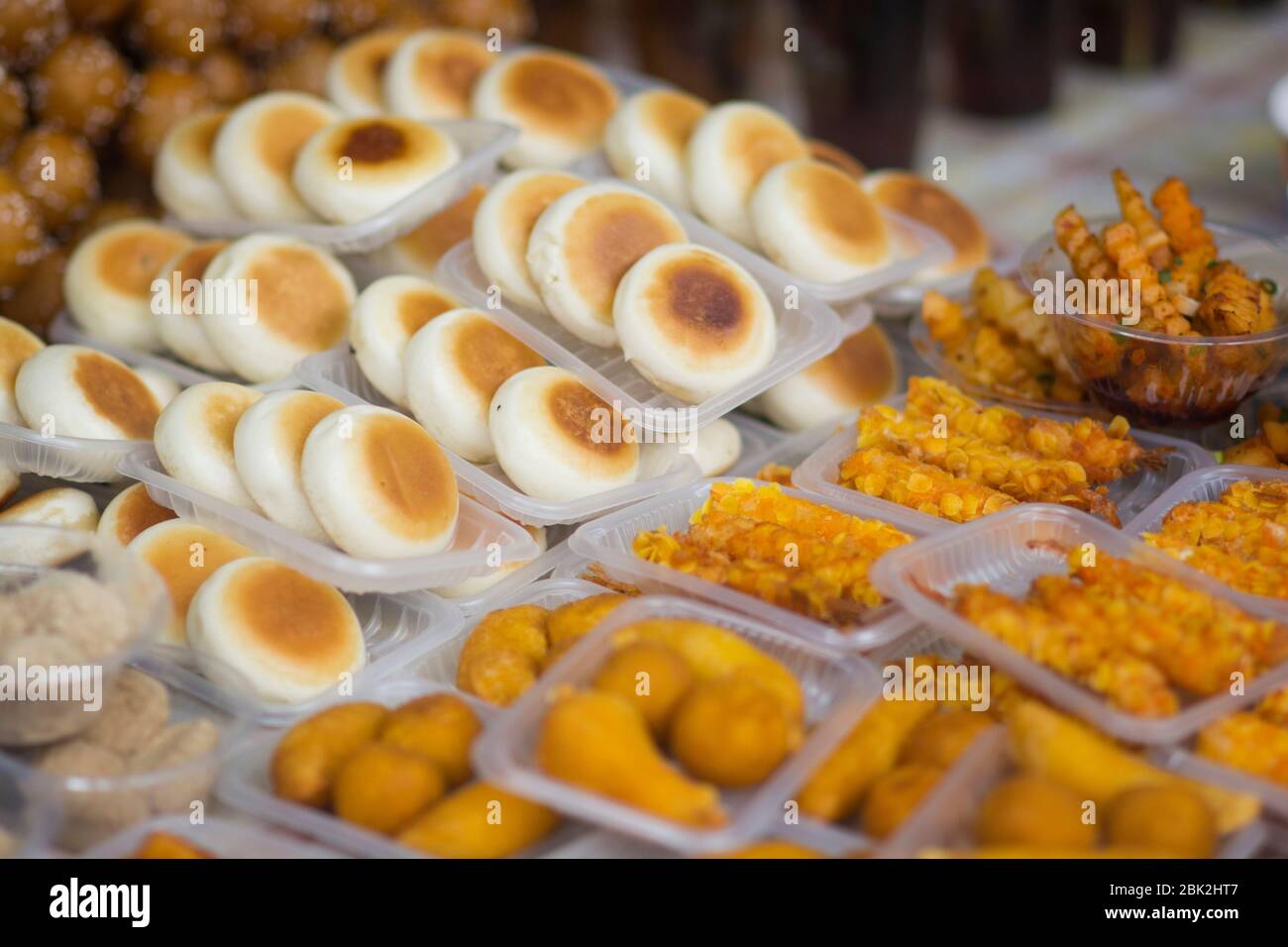 Traditional pan-fried Chinese buns, At the street food stand in the ...