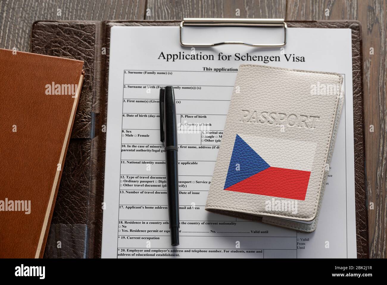 Application form, pen and a Czech passport Stock Photo - Alamy