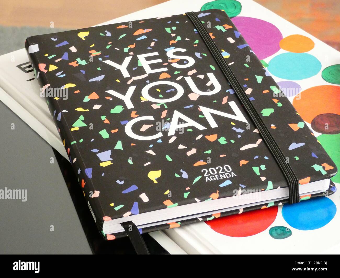 Diary and pencil on a coffee table Stock Photo - Alamy