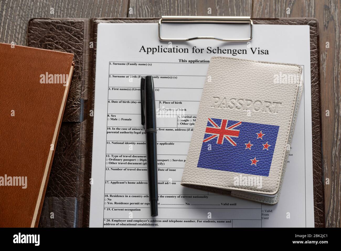 Application form, pen and a New Zealand passport Stock Photo - Alamy