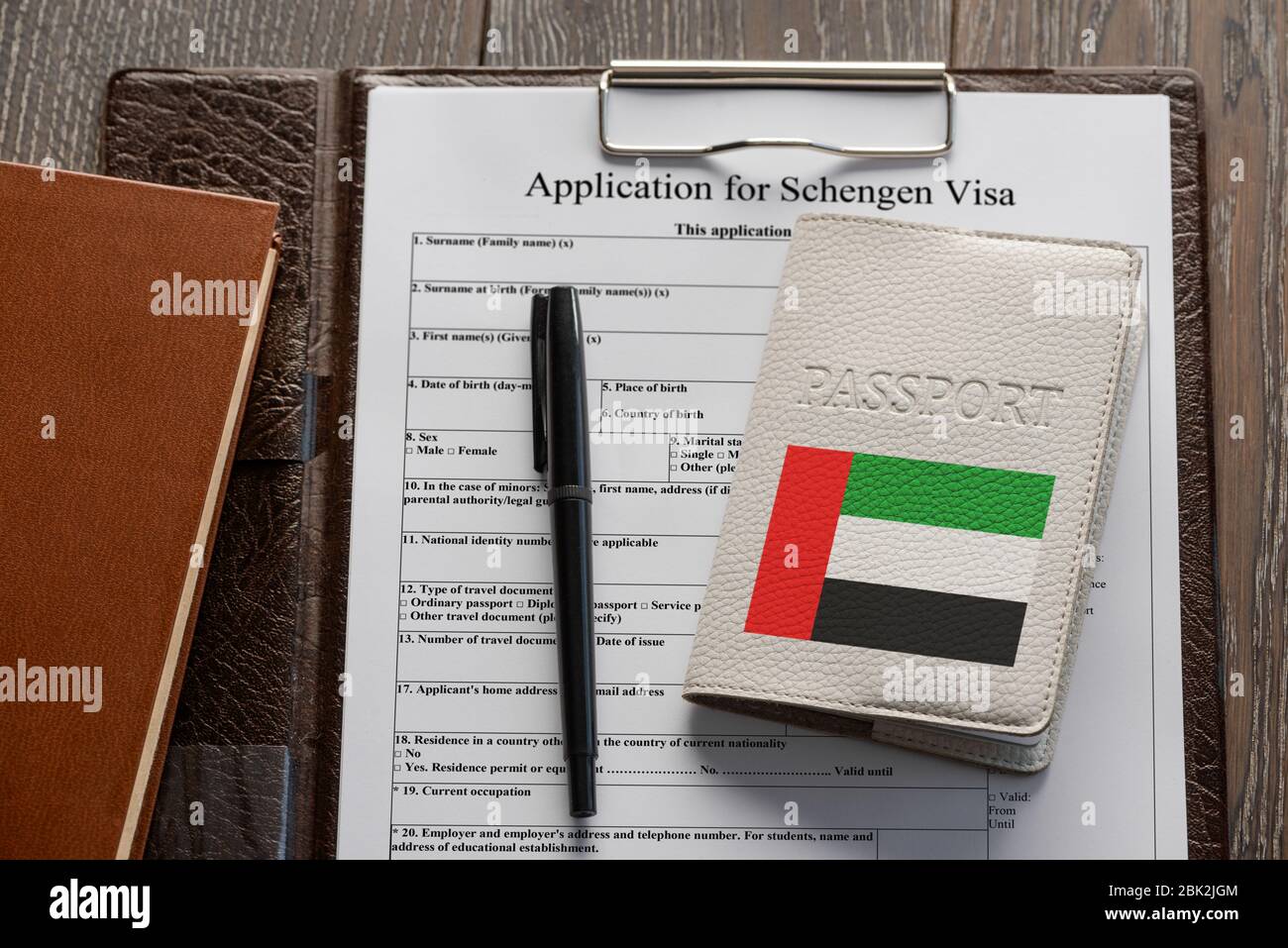 Application form, pen and a United Arab Emirates passport Stock Photo ...