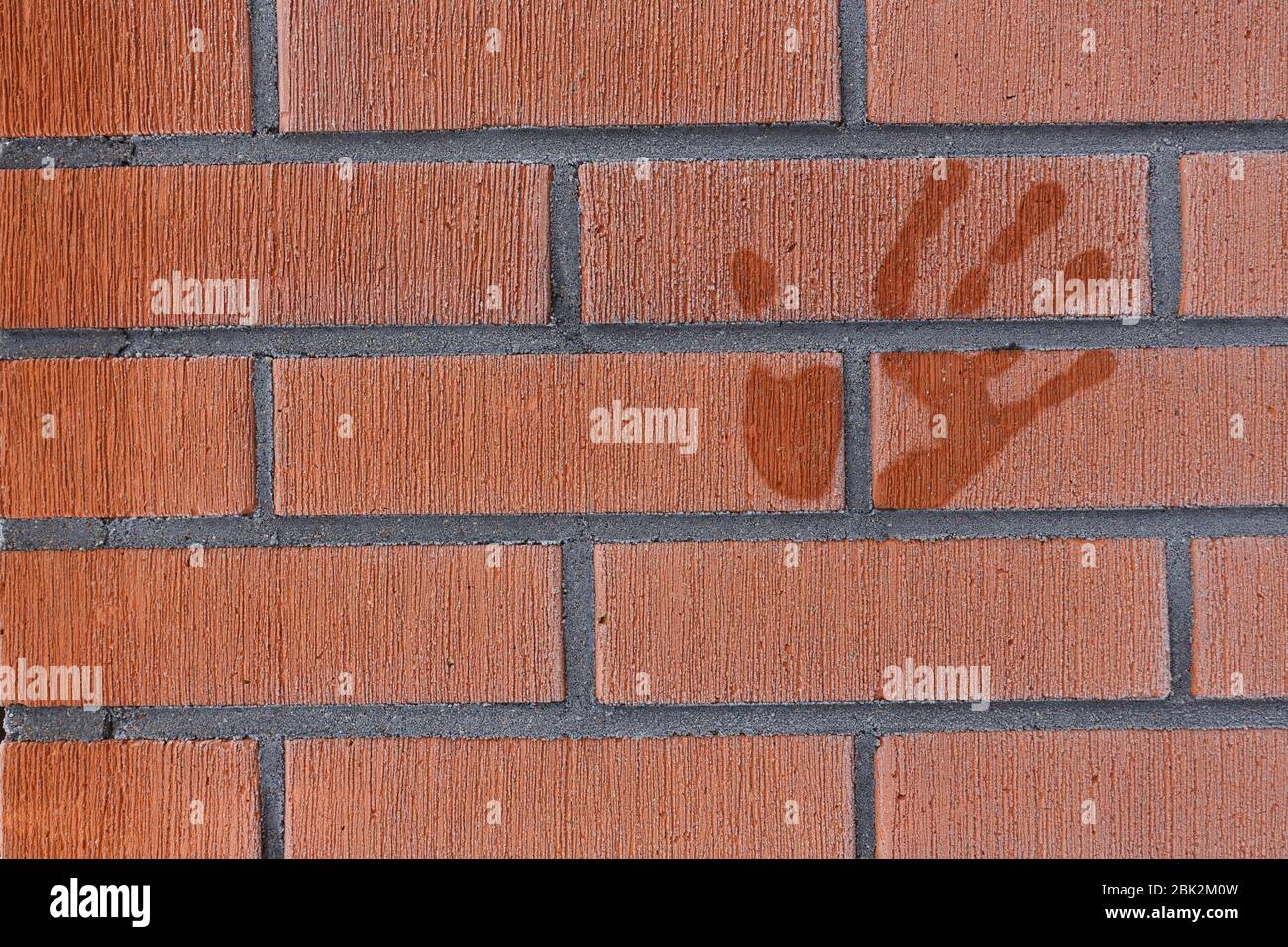 Wet melted palm print on frosty red tile wall at Winter , Finland Stock ...