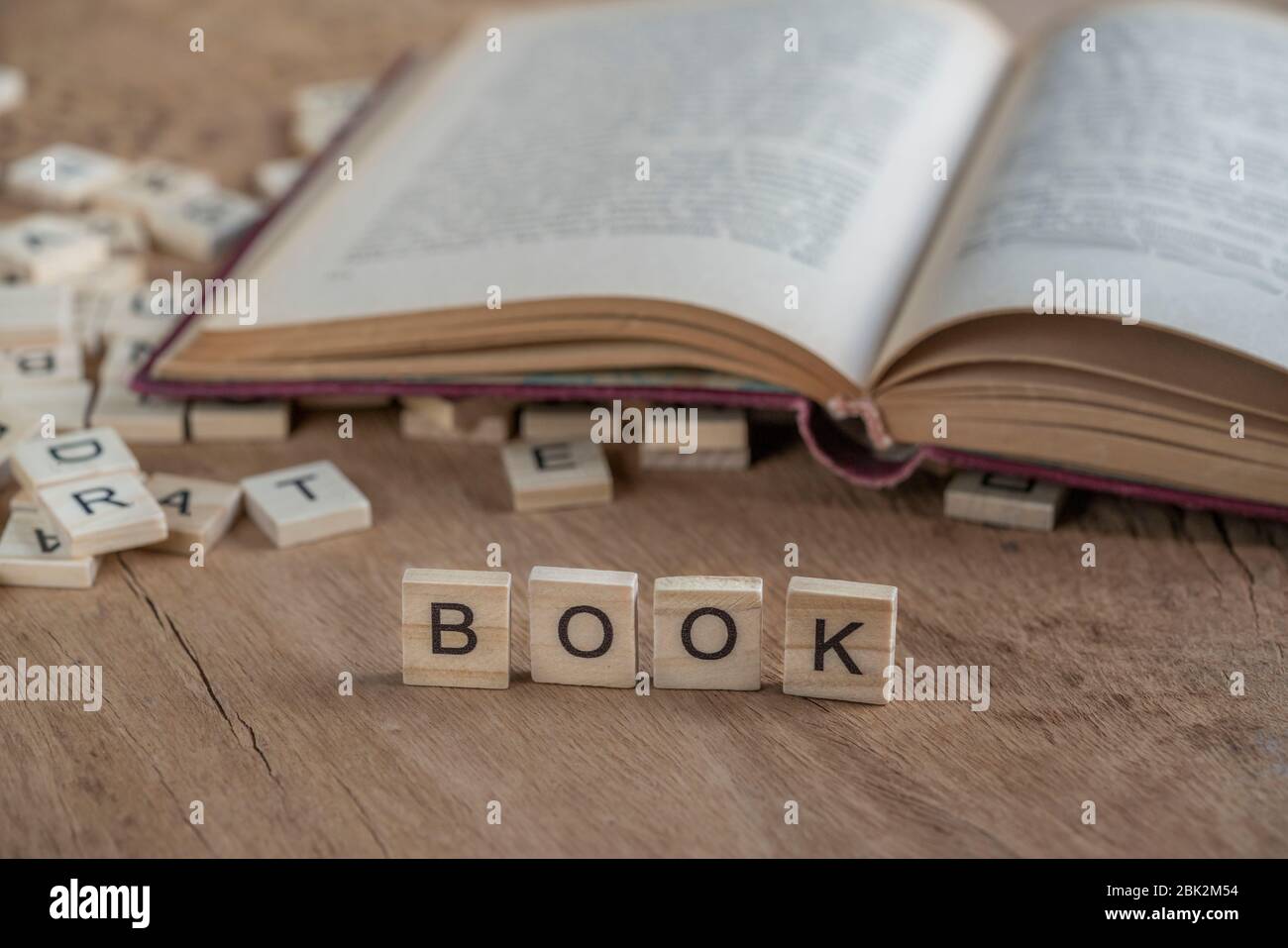 the word book written with cube letters on a wooden background Stock ...