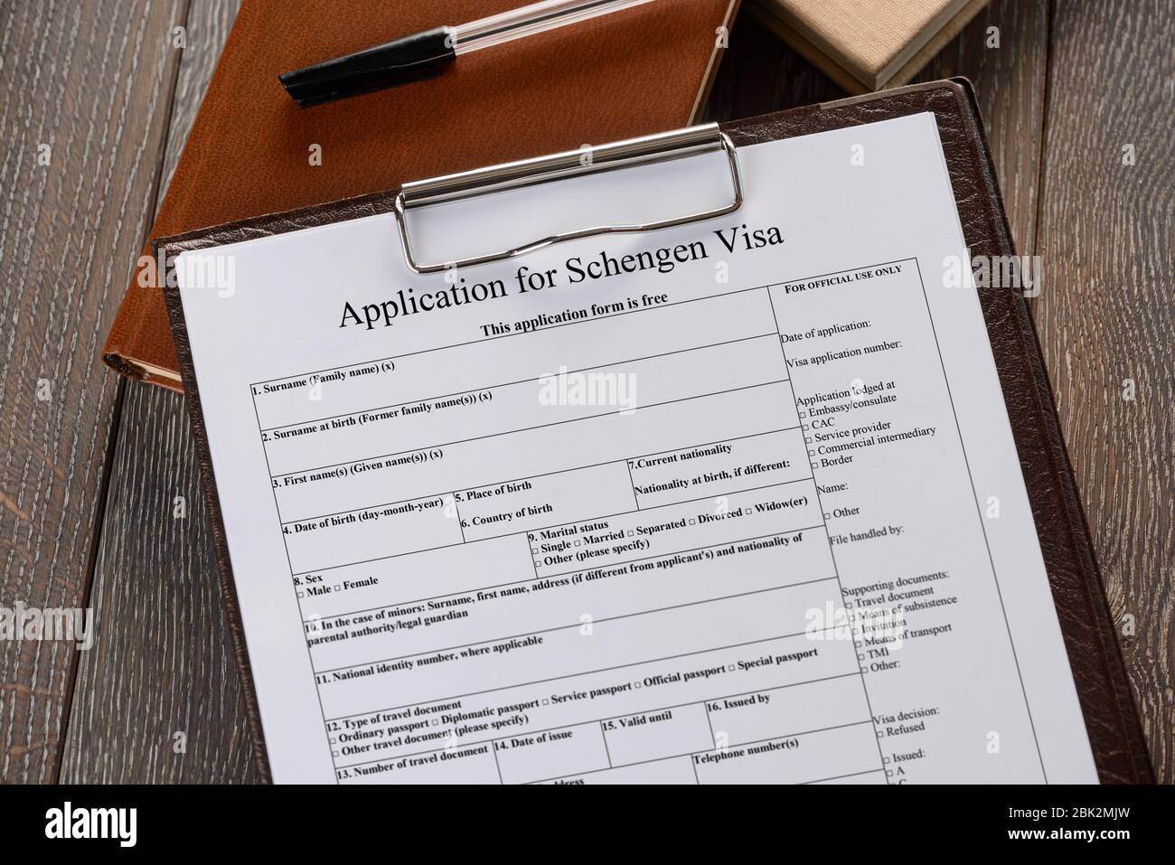 Filling an application to get a Schengen visa Stock Photo - Alamy