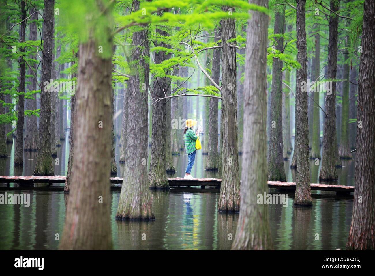 Yangzhou. 1st May, 2020. A tourist enjoys leisure time in an aquatic ...