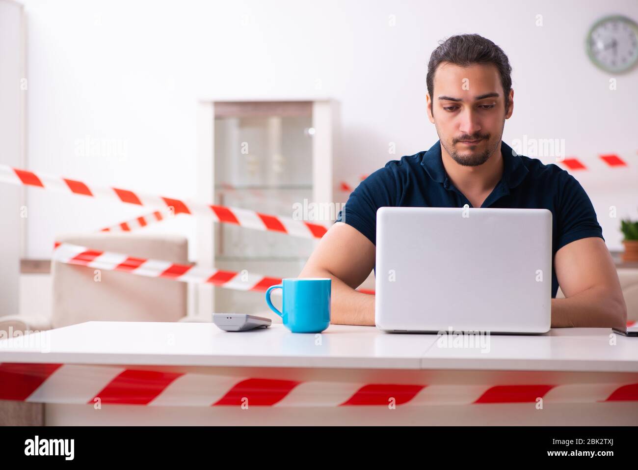 Young man feeling bored at the home in self-isolation concept Stock ...