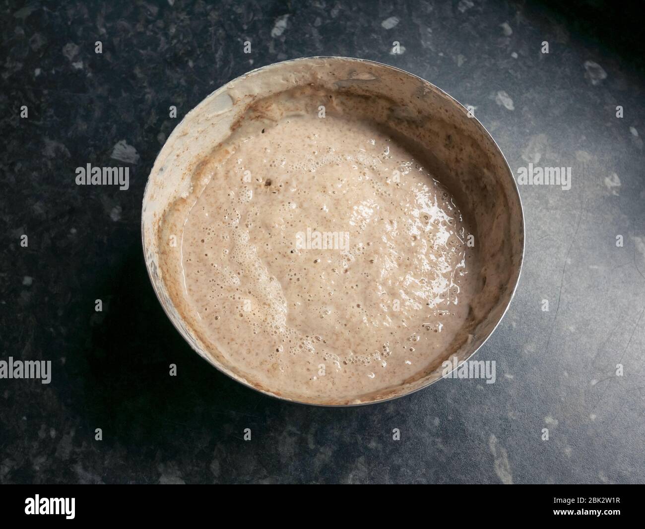 A top down view of a bubbling sourdough starter on a kitchen top Stock ...