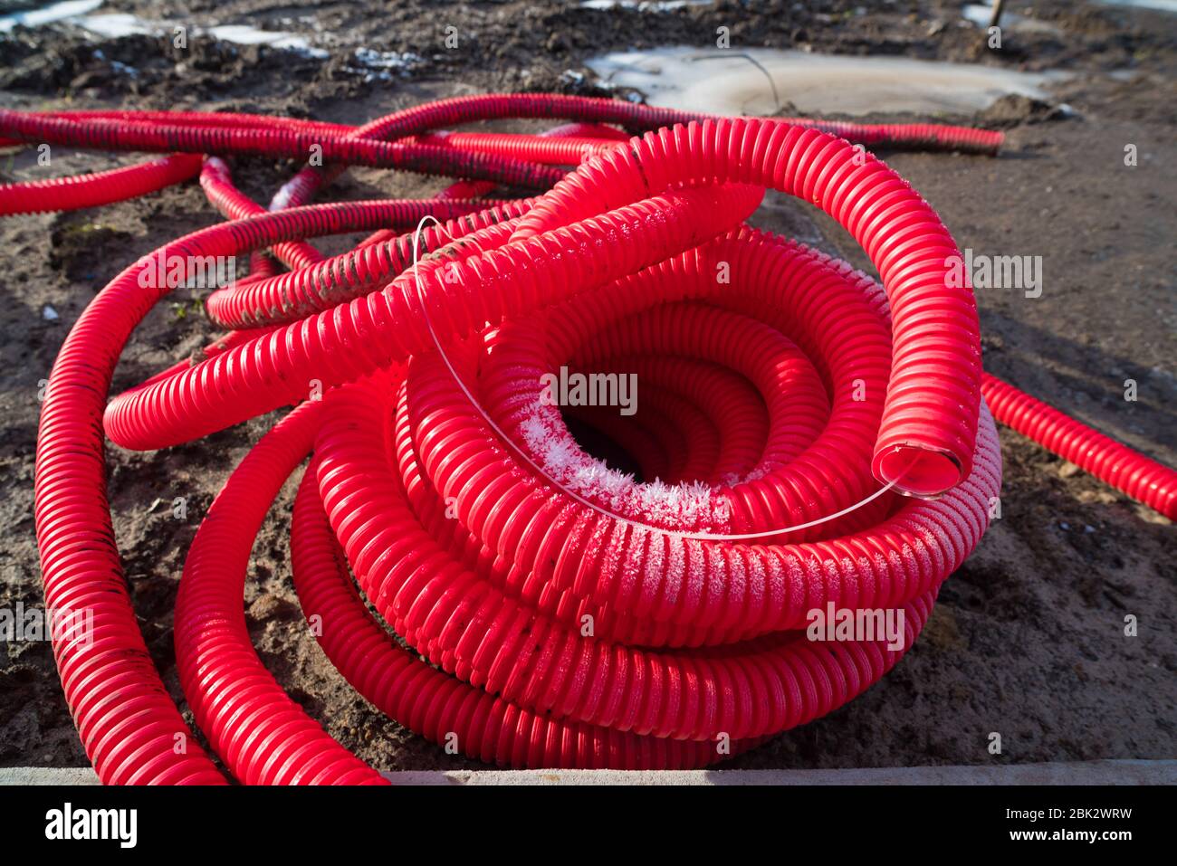 flexible red ribbed pvc pipes Stock Photo - Alamy