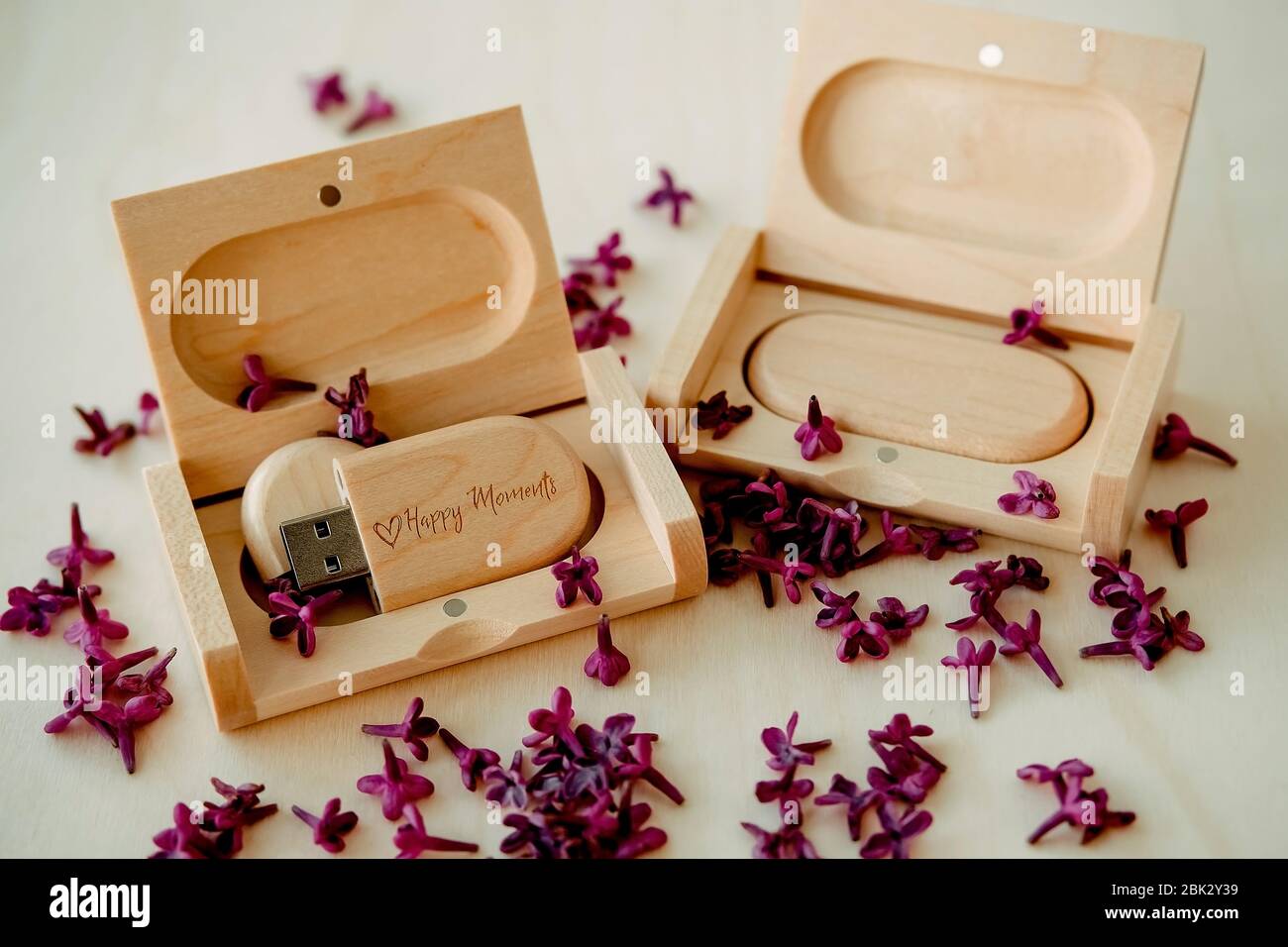 Wooden brown usb flash drives with boxes with the text Happy Moments ...