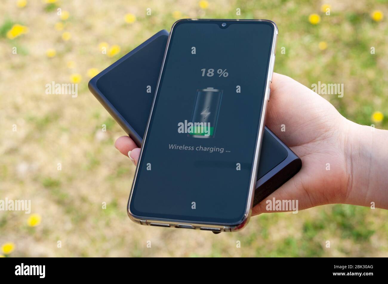 Smartphone charging without cable from induction power bank in the ...