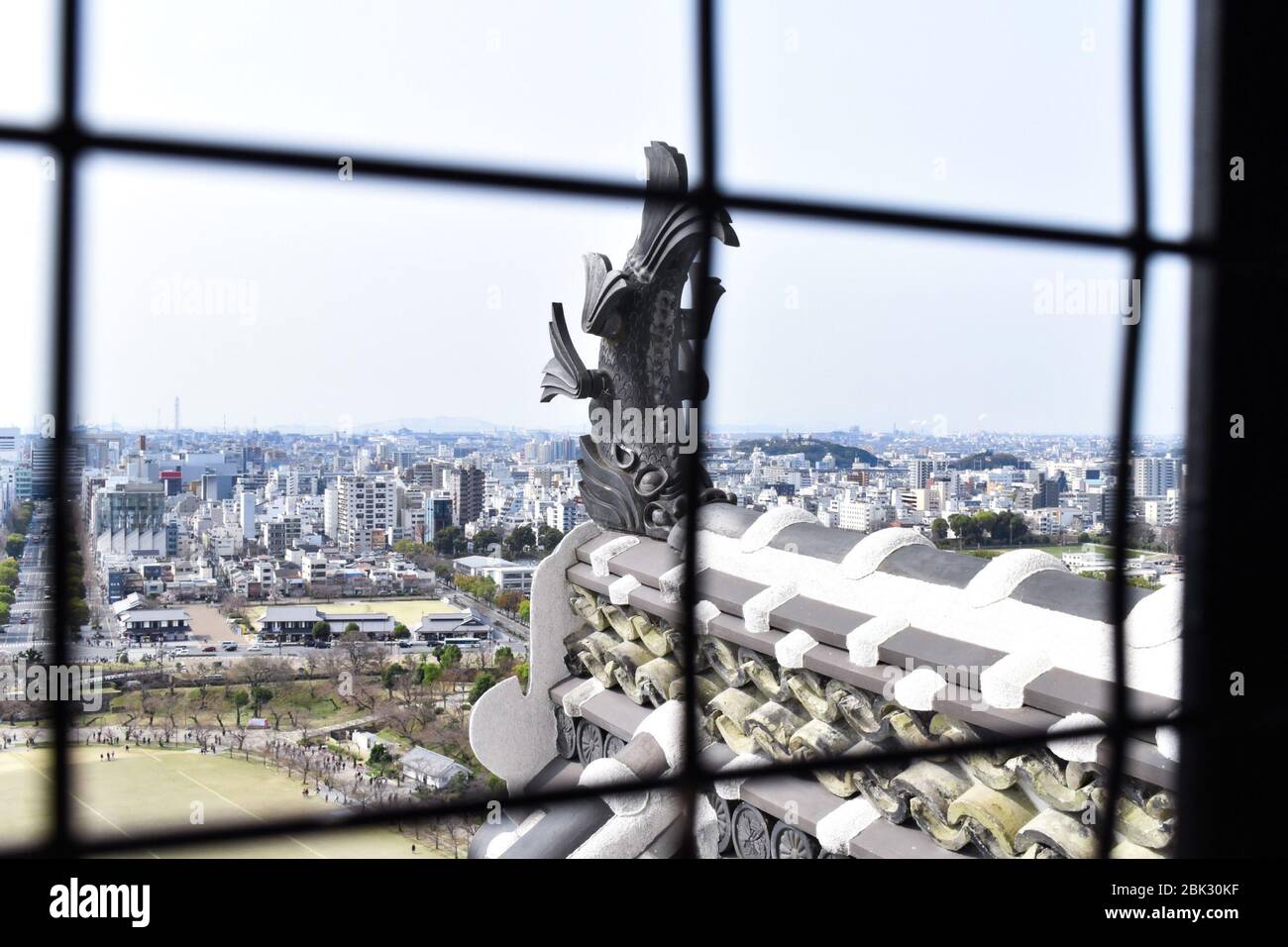 View from window on a detail of roof decoration and area of castle ...
