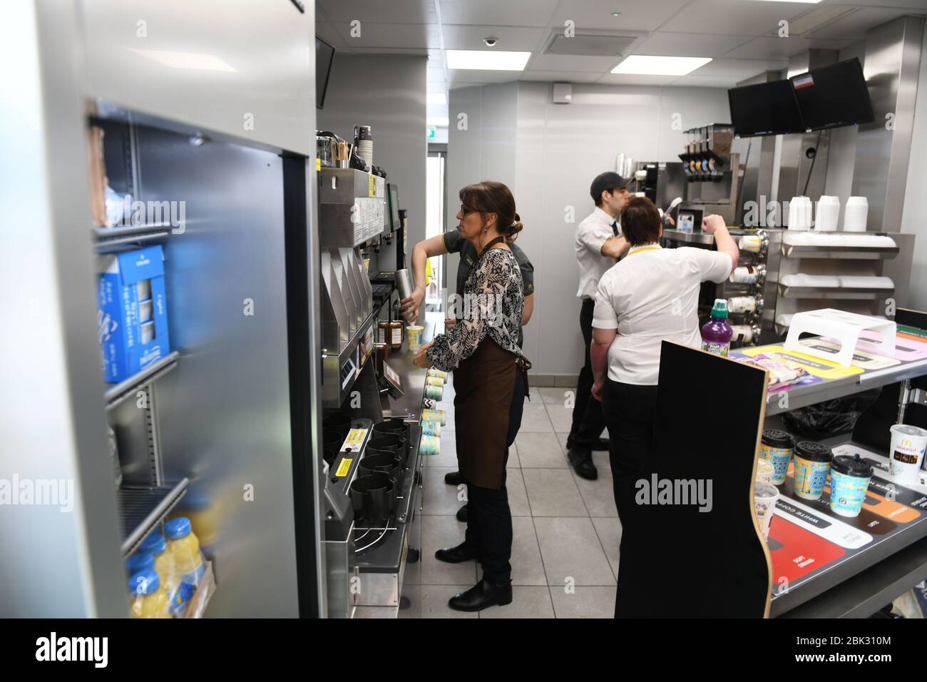 Members of staff pictured working in a McDonalds restaurant kitchen in ...