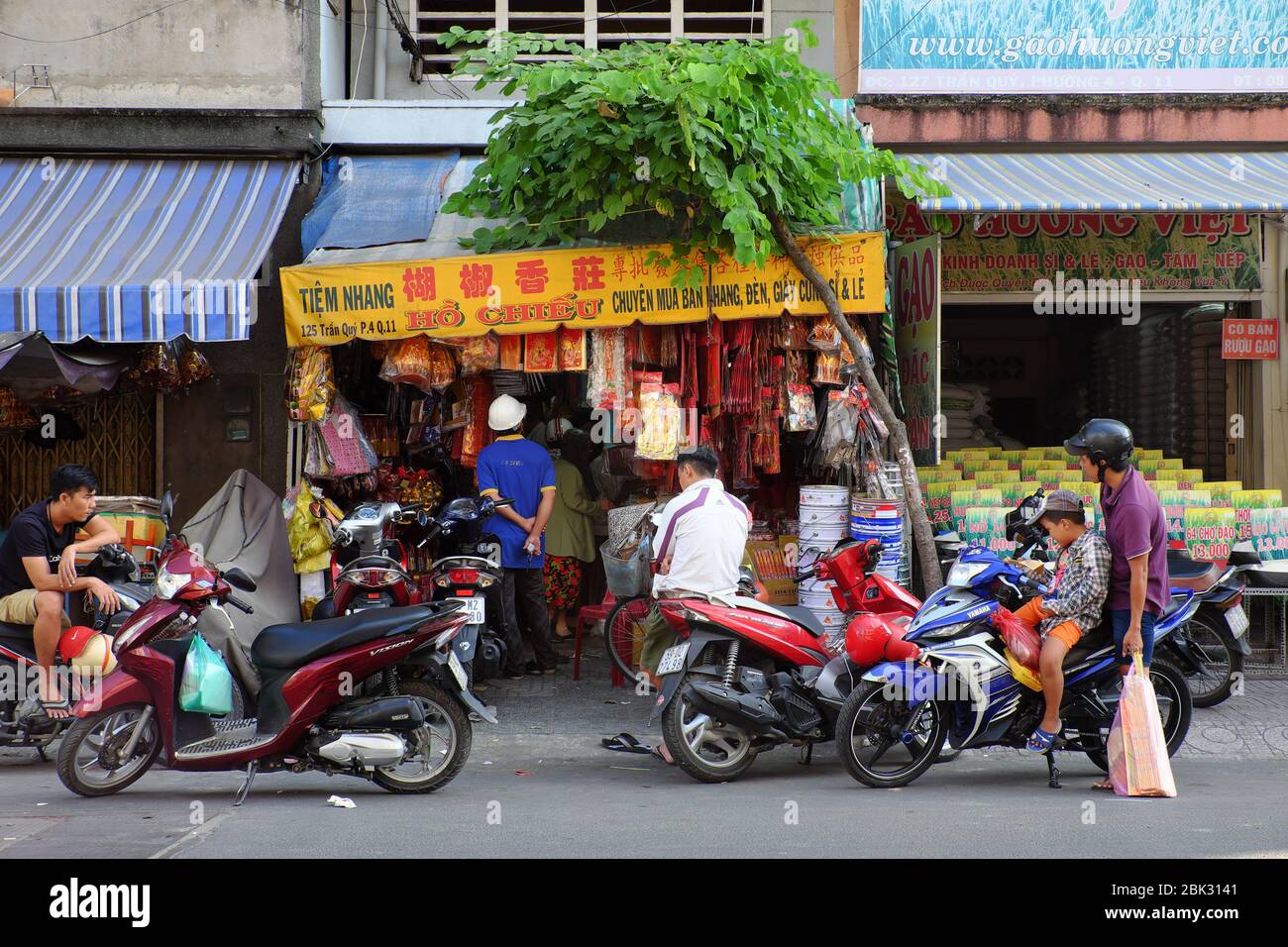 Vietnamese buy votive paper as offerings to worship, traditional ...