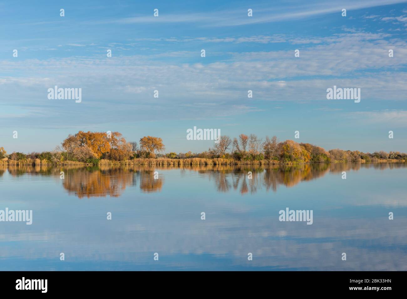 A scenic reflective lake during autumn Stock Photo - Alamy