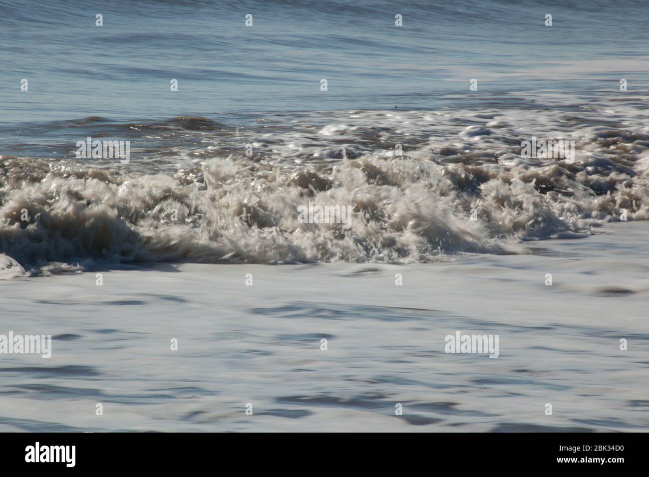 Ocean waves breaking at the beach Stock Photo - Alamy