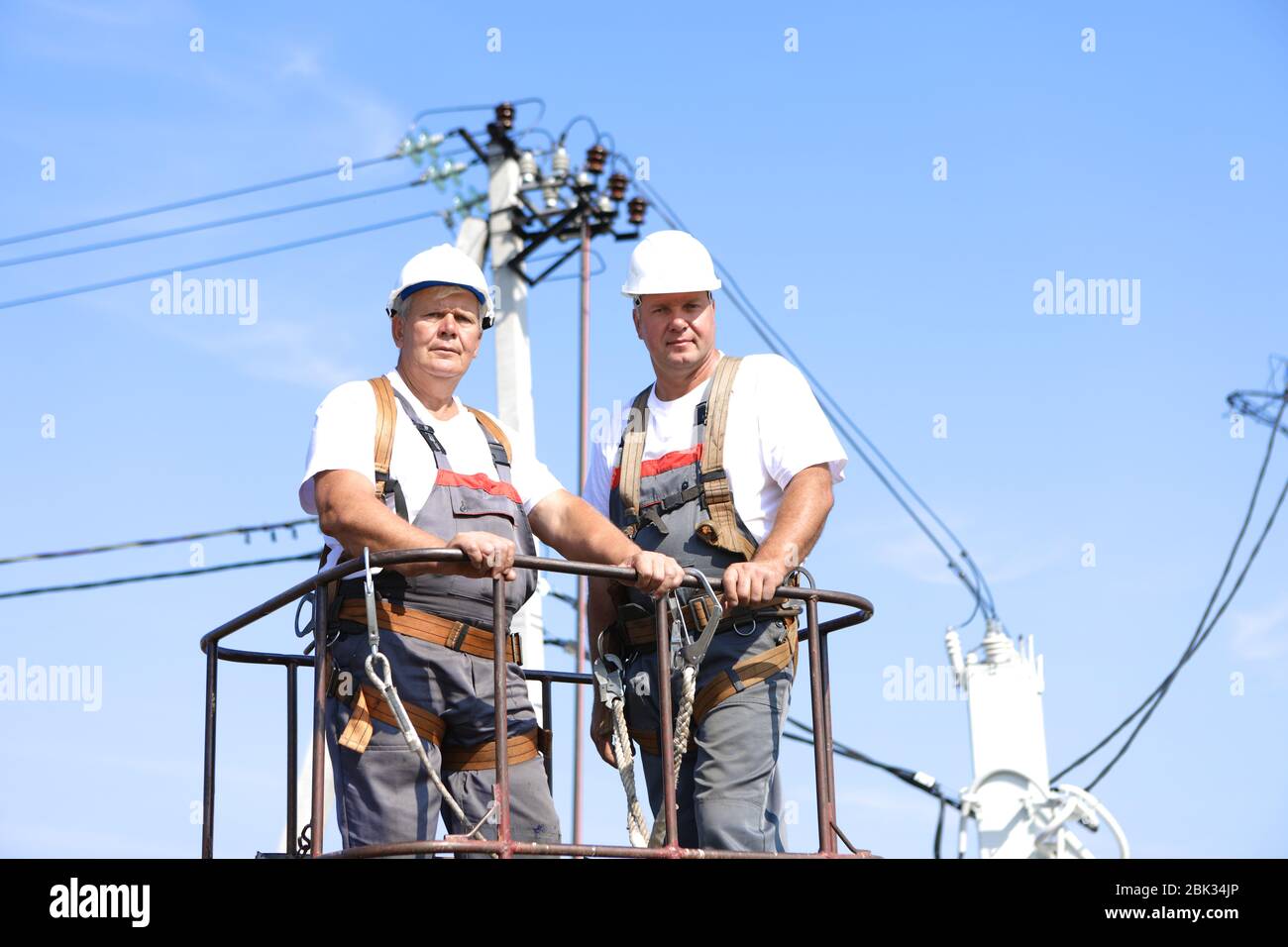 Electrical Power Lines Workers High Resolution Stock Photography and ...