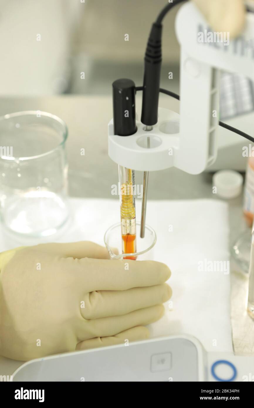 A chemist conducts a study of the stiffness of the solution. Laboratory ...