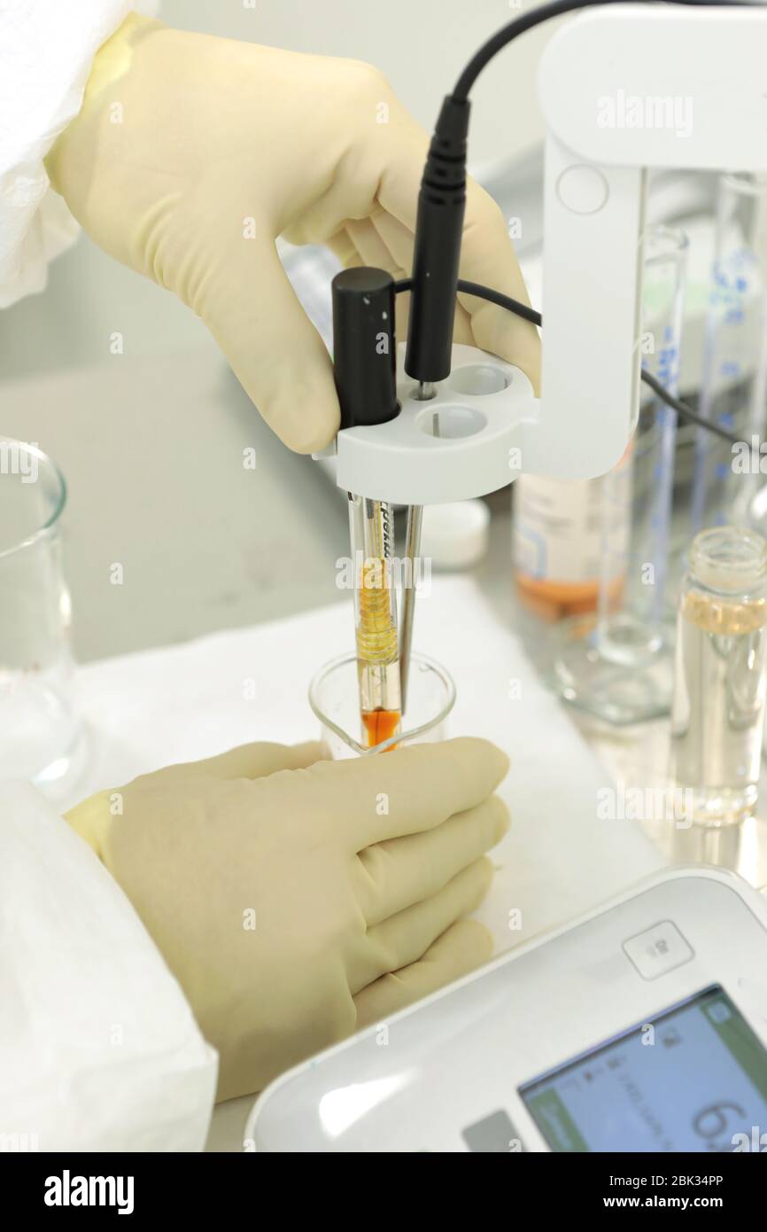 A chemist conducts a study of the stiffness of the solution. Laboratory ...