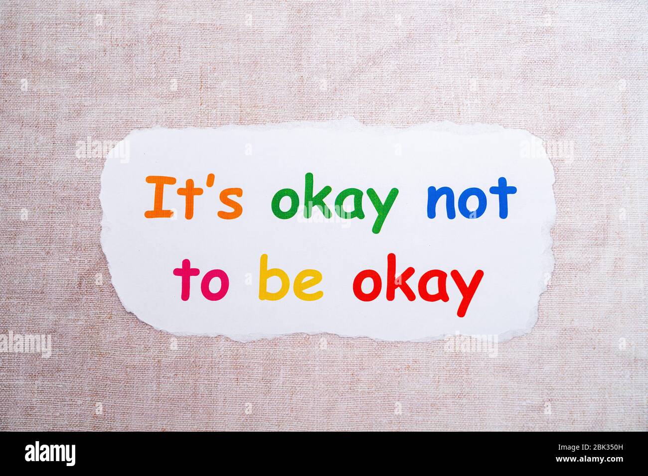 Mental health and confidence issues with a text sign Its OK not to be ...
