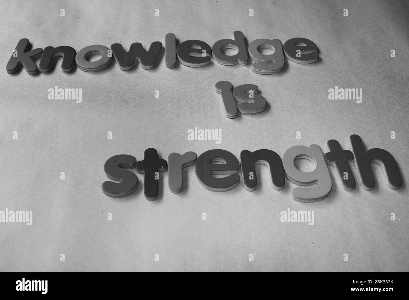 Knowledge is strength. Knowledge is strength written on wall by using ...