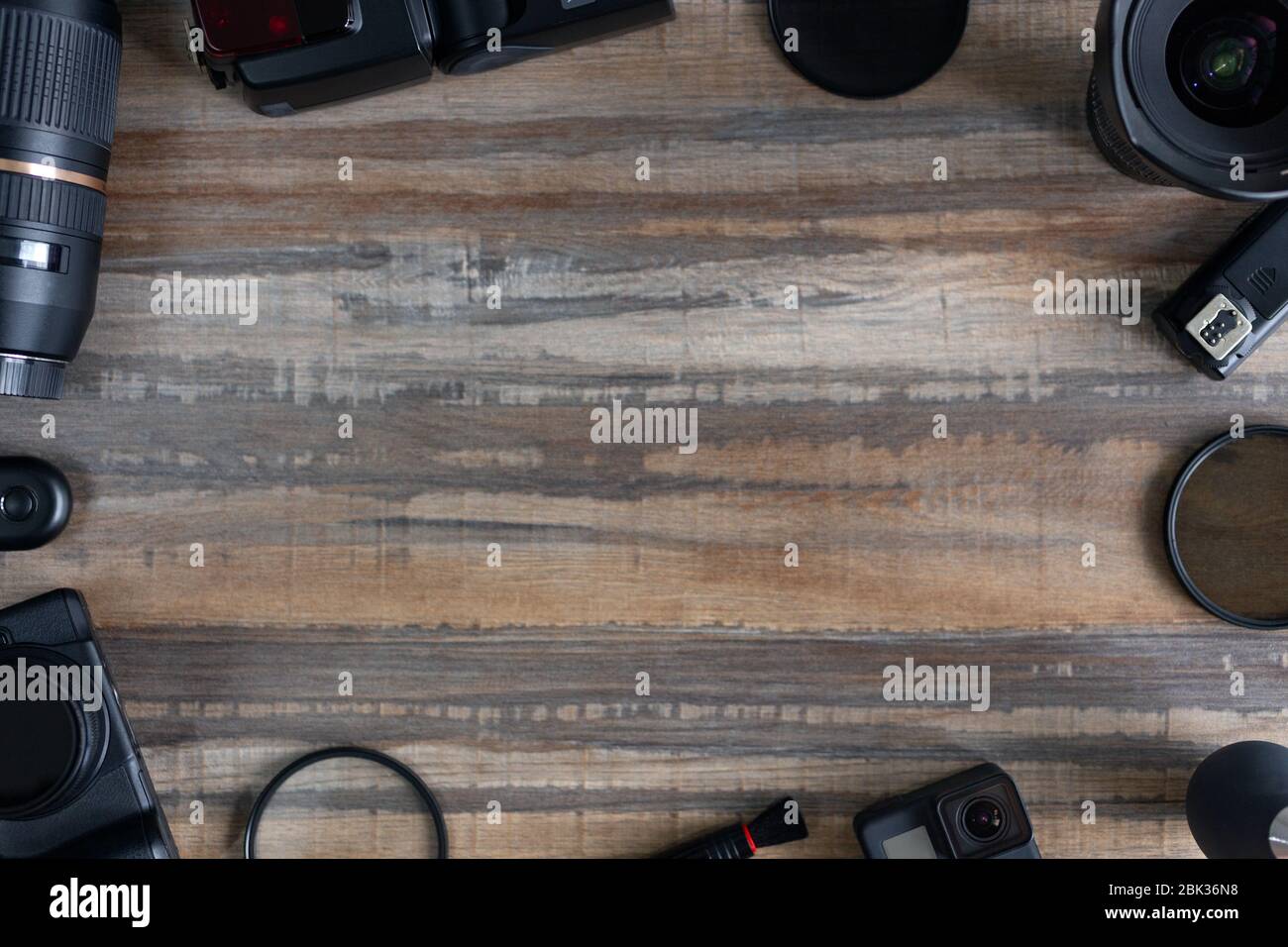 Flat lay of photography equipment on wooden desktop background: dslr ...
