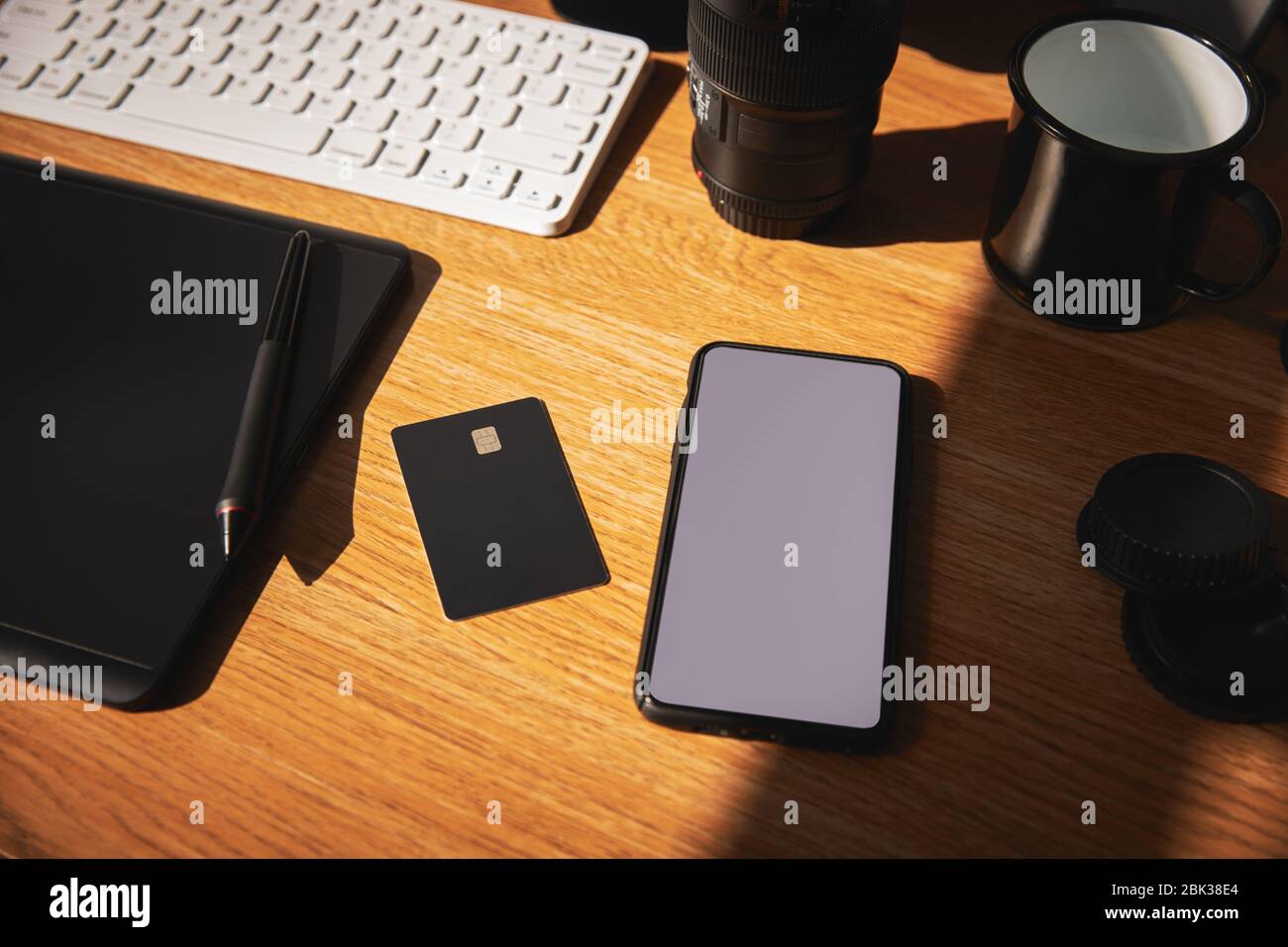 Smart phone on desk of creative with blank white screen Stock Photo - Alamy