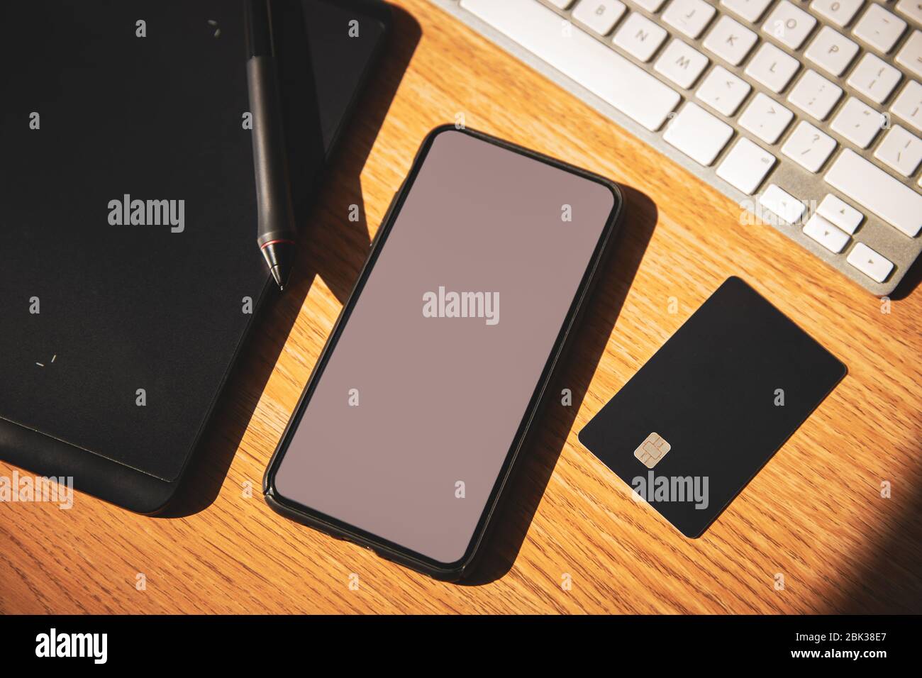 Smart phone on desk of creative with blank white screen Stock Photo - Alamy